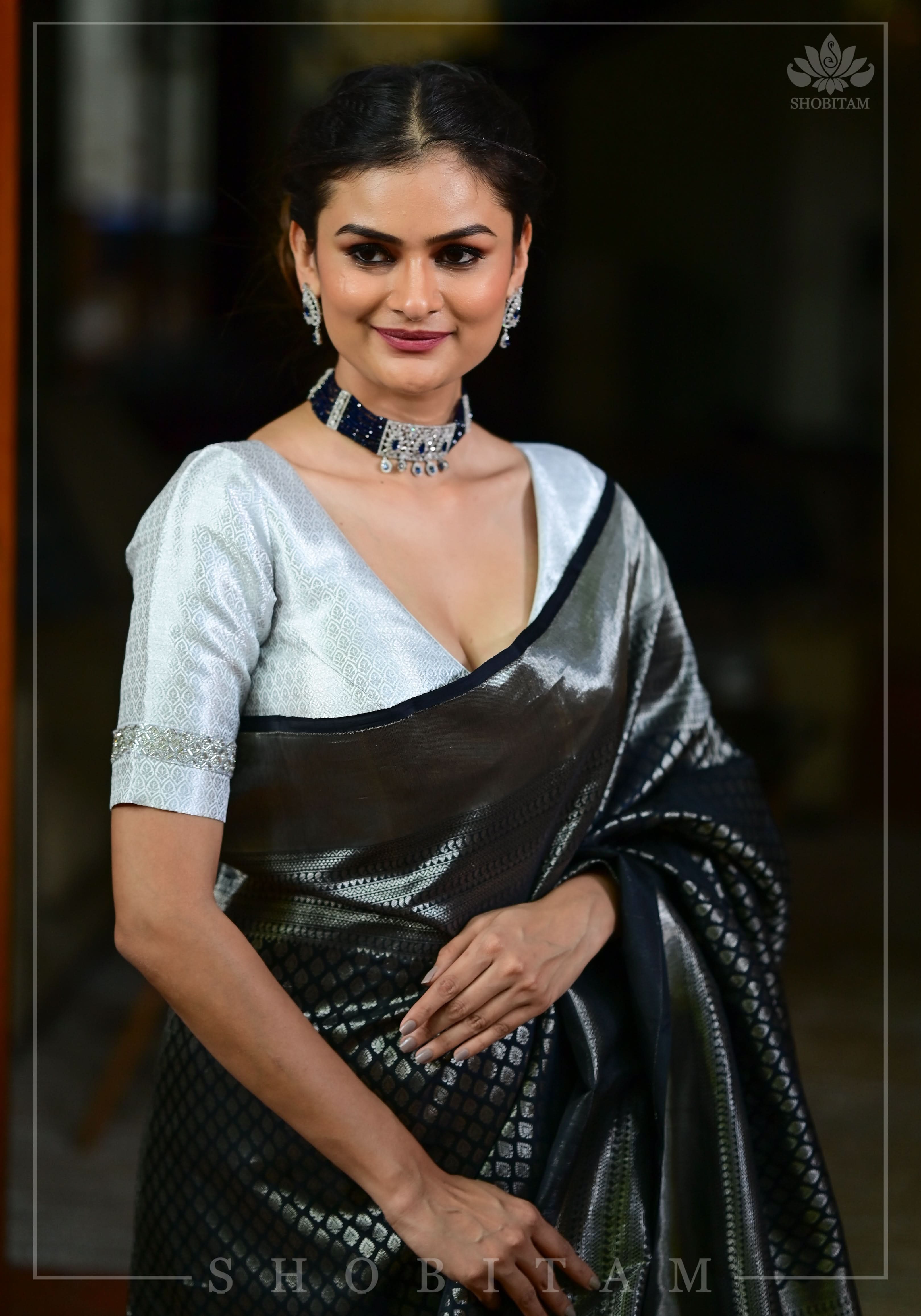 V neck Silver blouse with stonework Trim on Sleeve and cutdana tassels ...